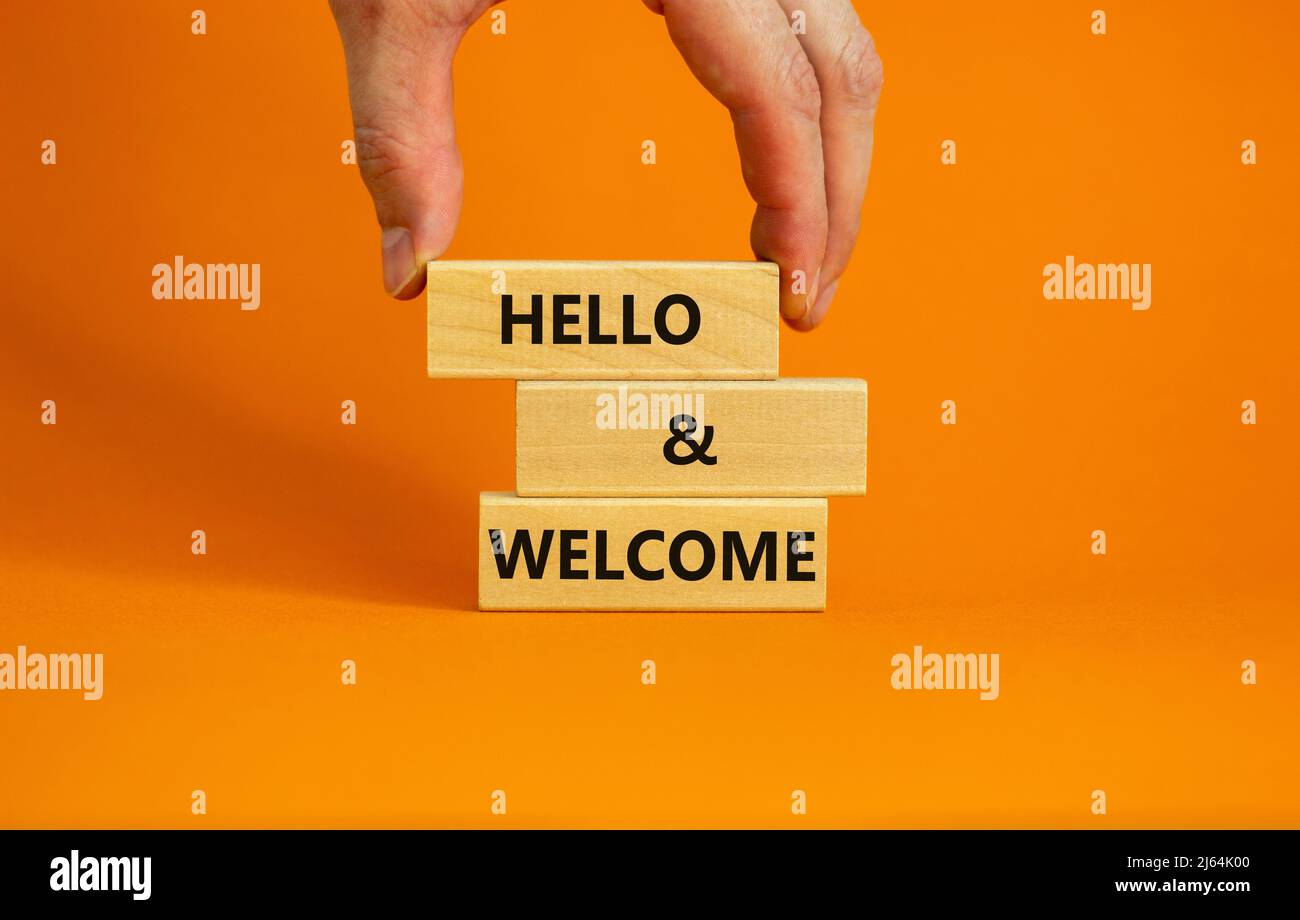 Hello and welcome symbol. Concept words Hello and welcome on wooden ...