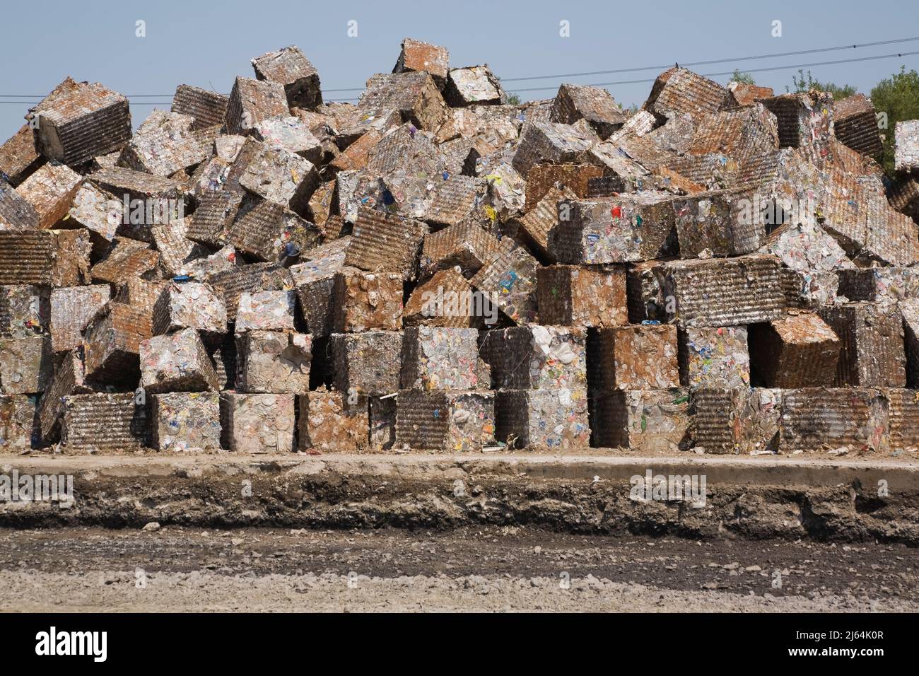 Bales of compacted plastic containers at a recycling yard Stock Photo ...