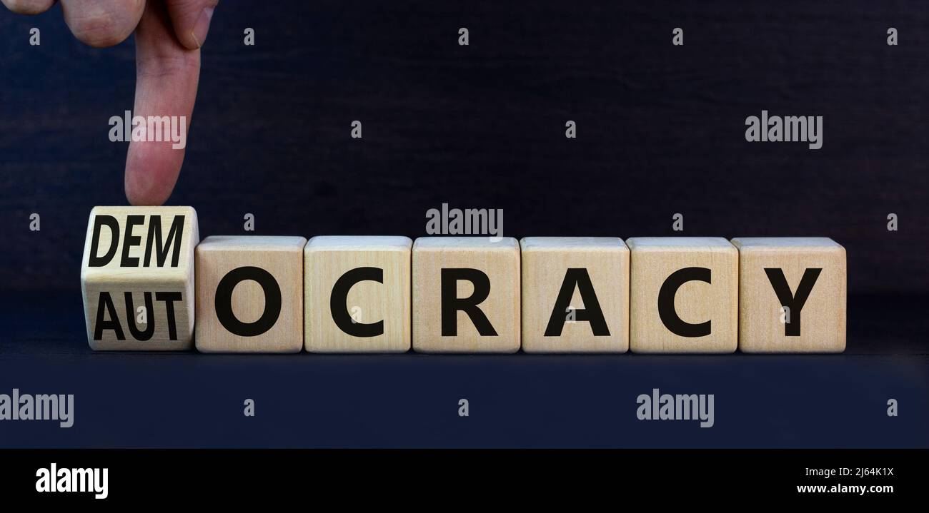 Democracy or autocracy symbol. Turned wooden cubes and changed the ...