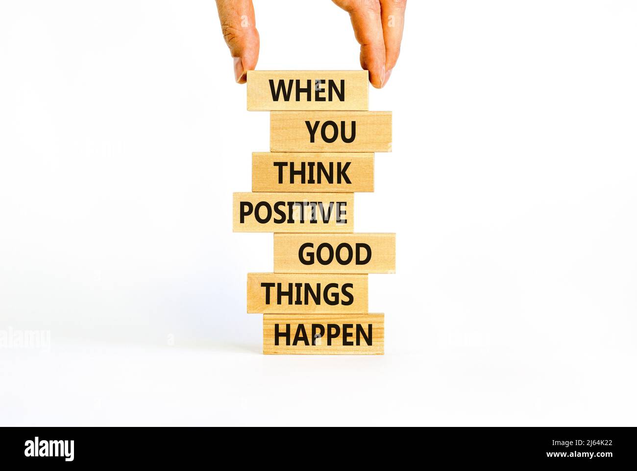Think positive symbol. Wooden blocks with concept words When you think ...