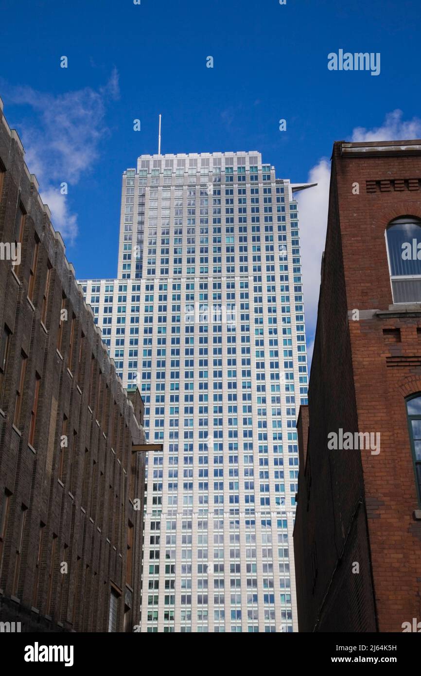 View of a modern architectural office tower between two older buildings ...