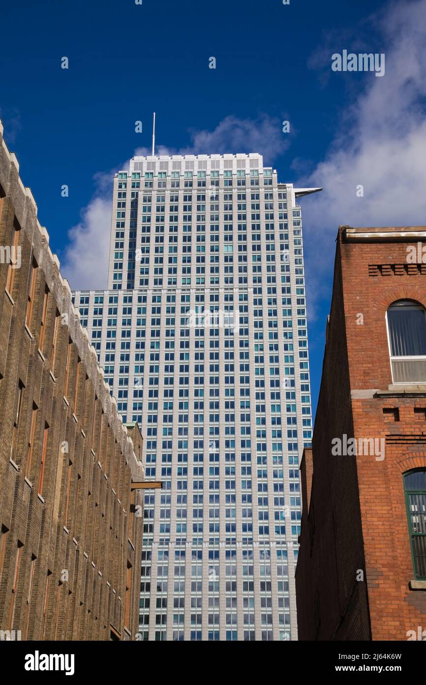 View of a modern architectural office tower between two older buildings ...