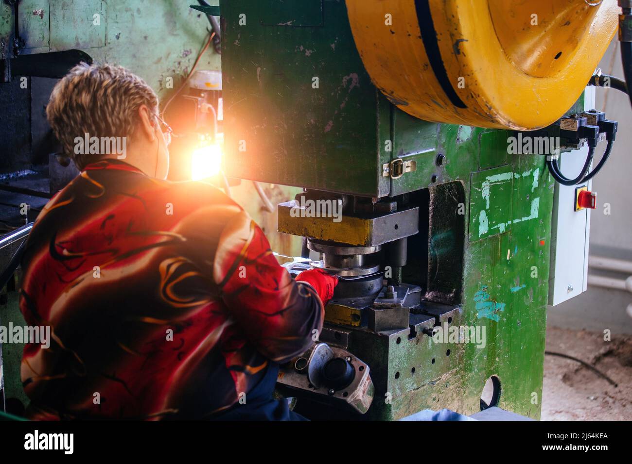 Worker operating plate bending machine hi-res stock photography and ...