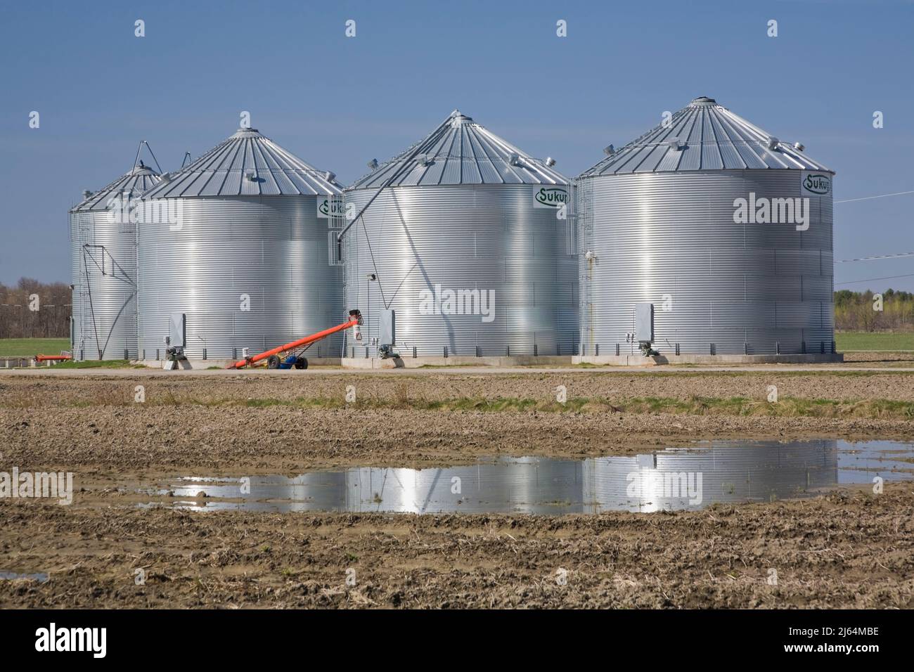 Grain storage bins in an agricultural field Stock Photo - Alamy