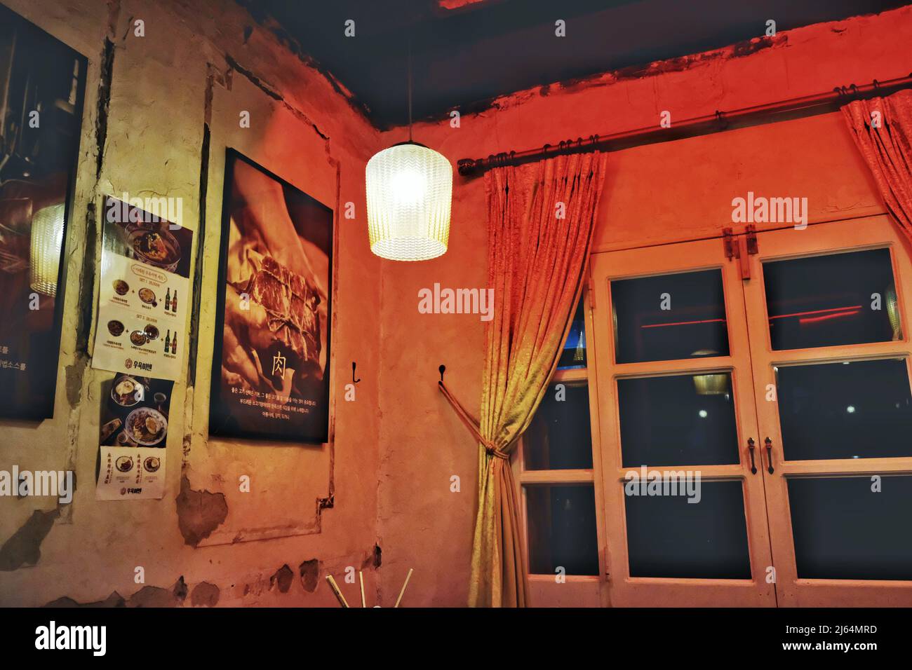 Inside a restaurant in a red light Stock Photo - Alamy