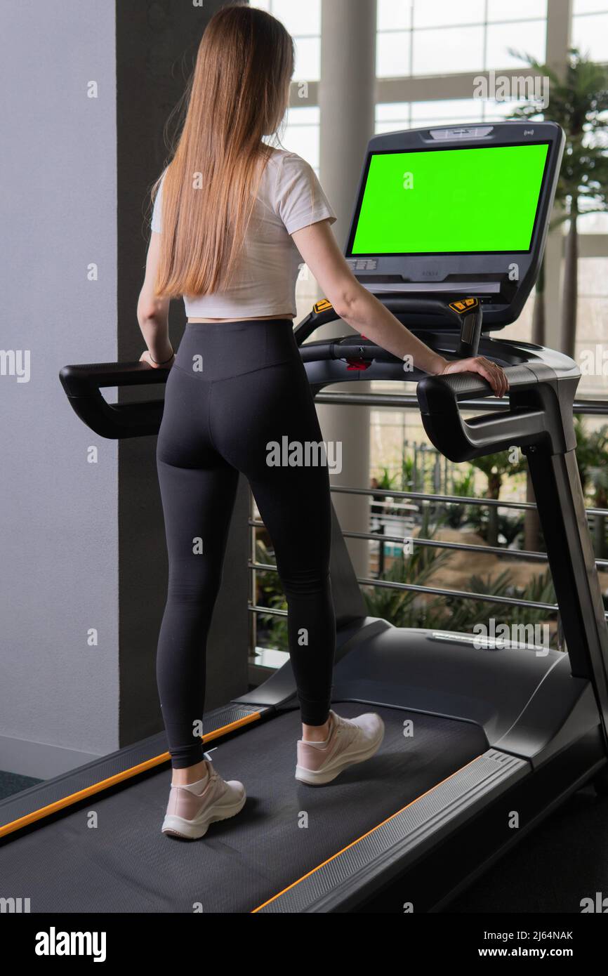 Length indoors young woman treadmill profile full running female, from ...