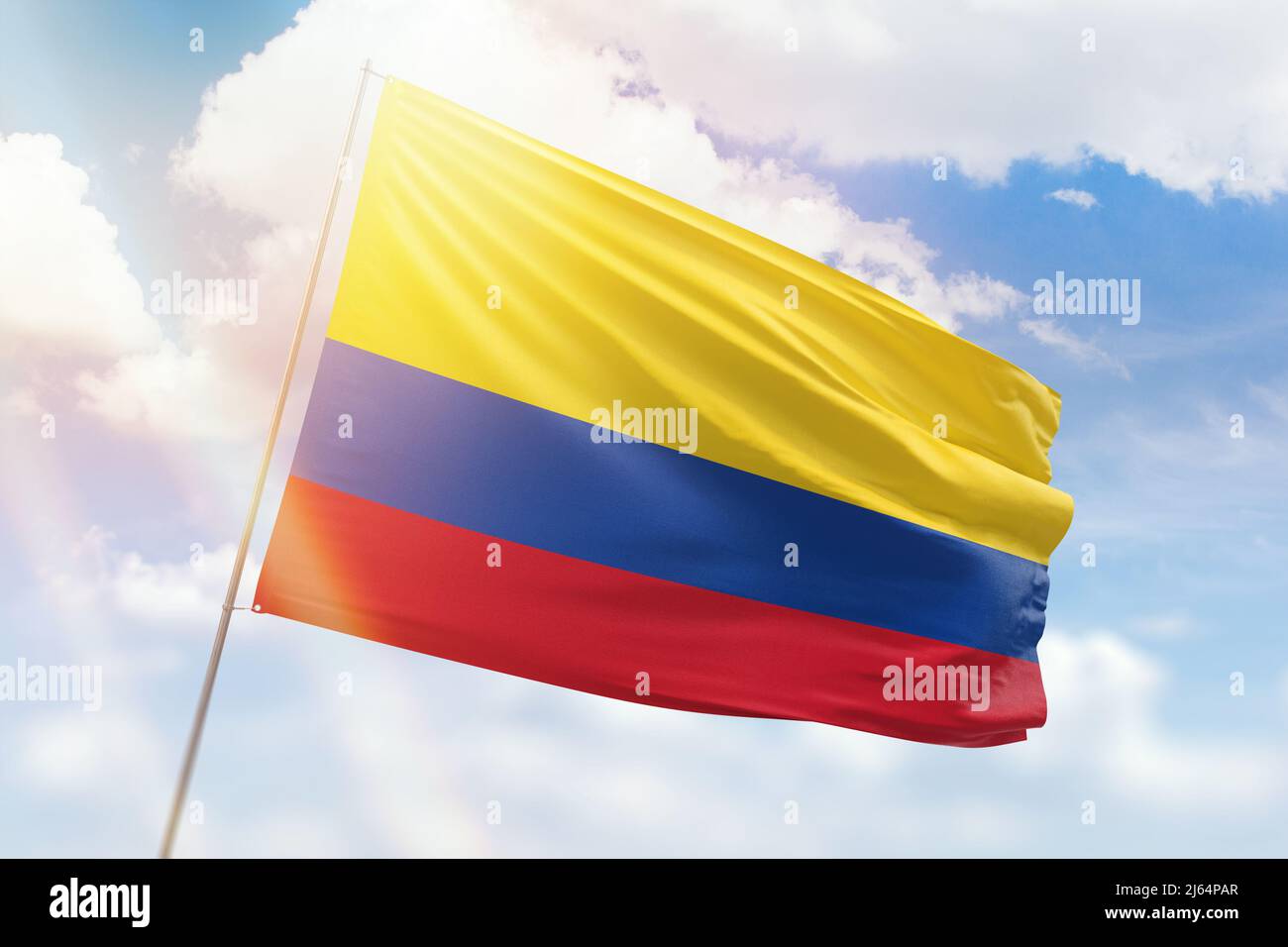 Sunny blue sky and a flagpole with the flag of colombia Stock Photo - Alamy