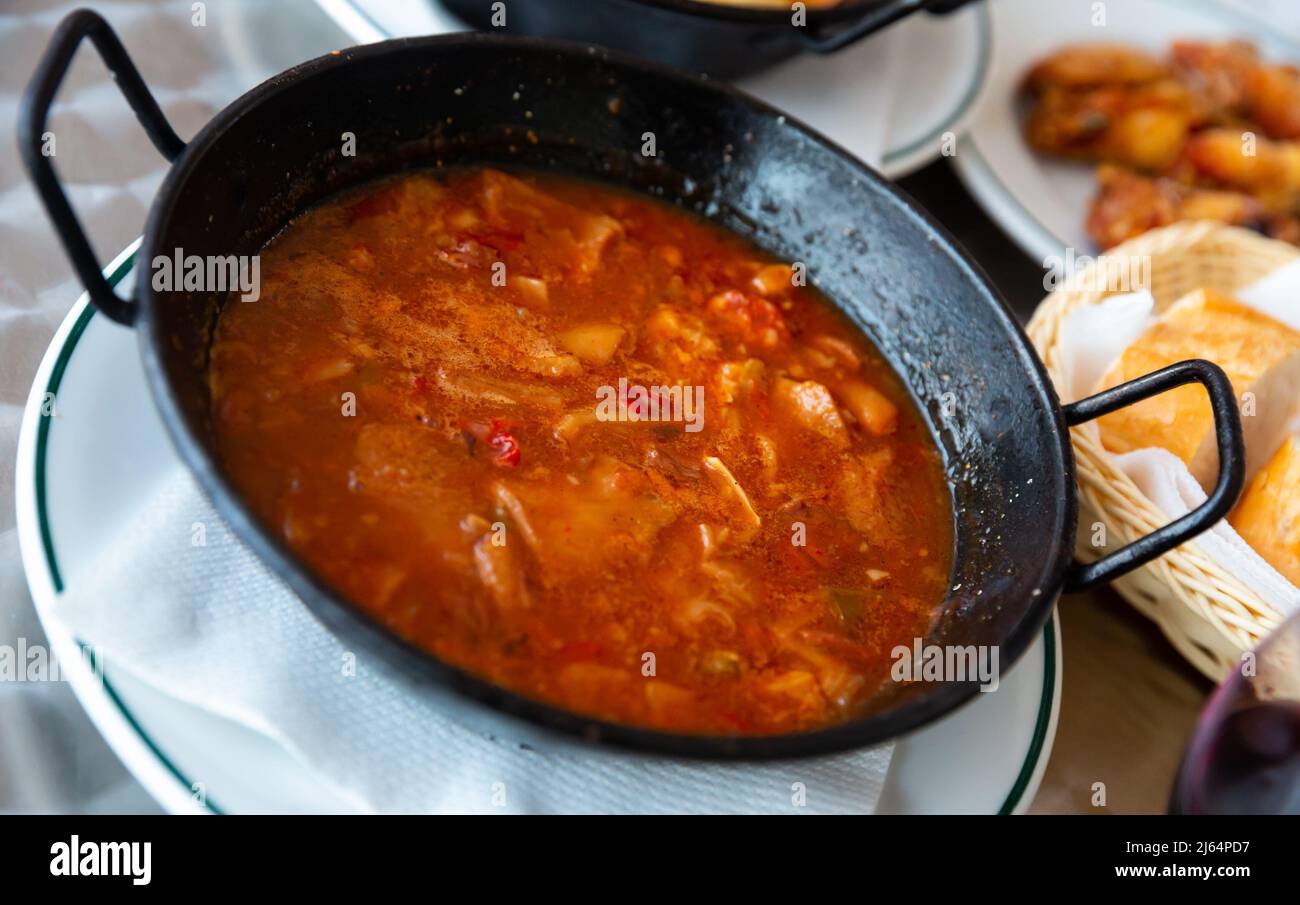 Traditional Spanish tripe dish Callos cooked with chickpea, chorizo and ...