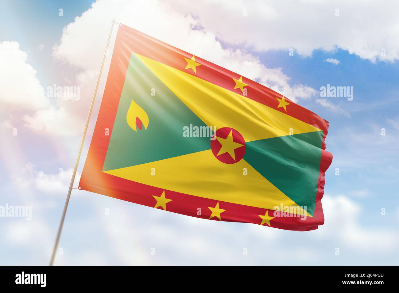 Sunny blue sky and a flagpole with the flag of grenada Stock Photo - Alamy