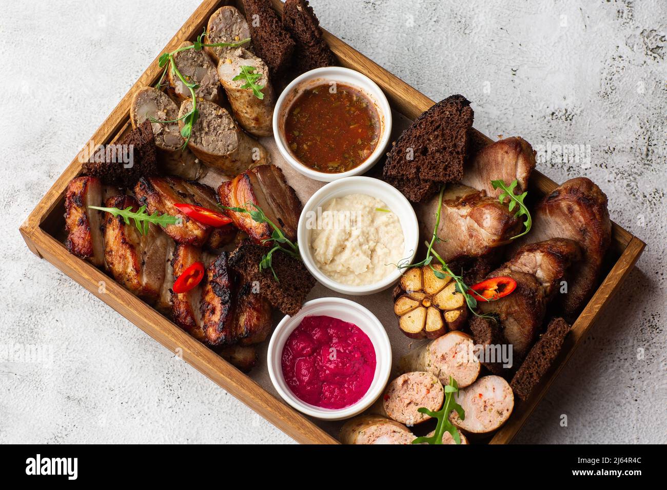 Close-up photo of mixed grilled meat platter. Beef, pork, poultry ...