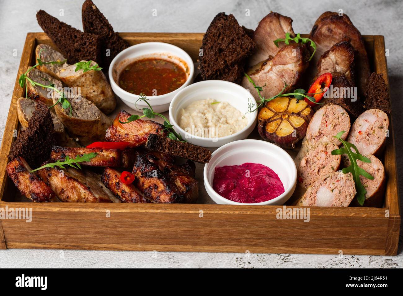 Close-up photo of mixed grilled meat platter. Beef, pork, poultry ...