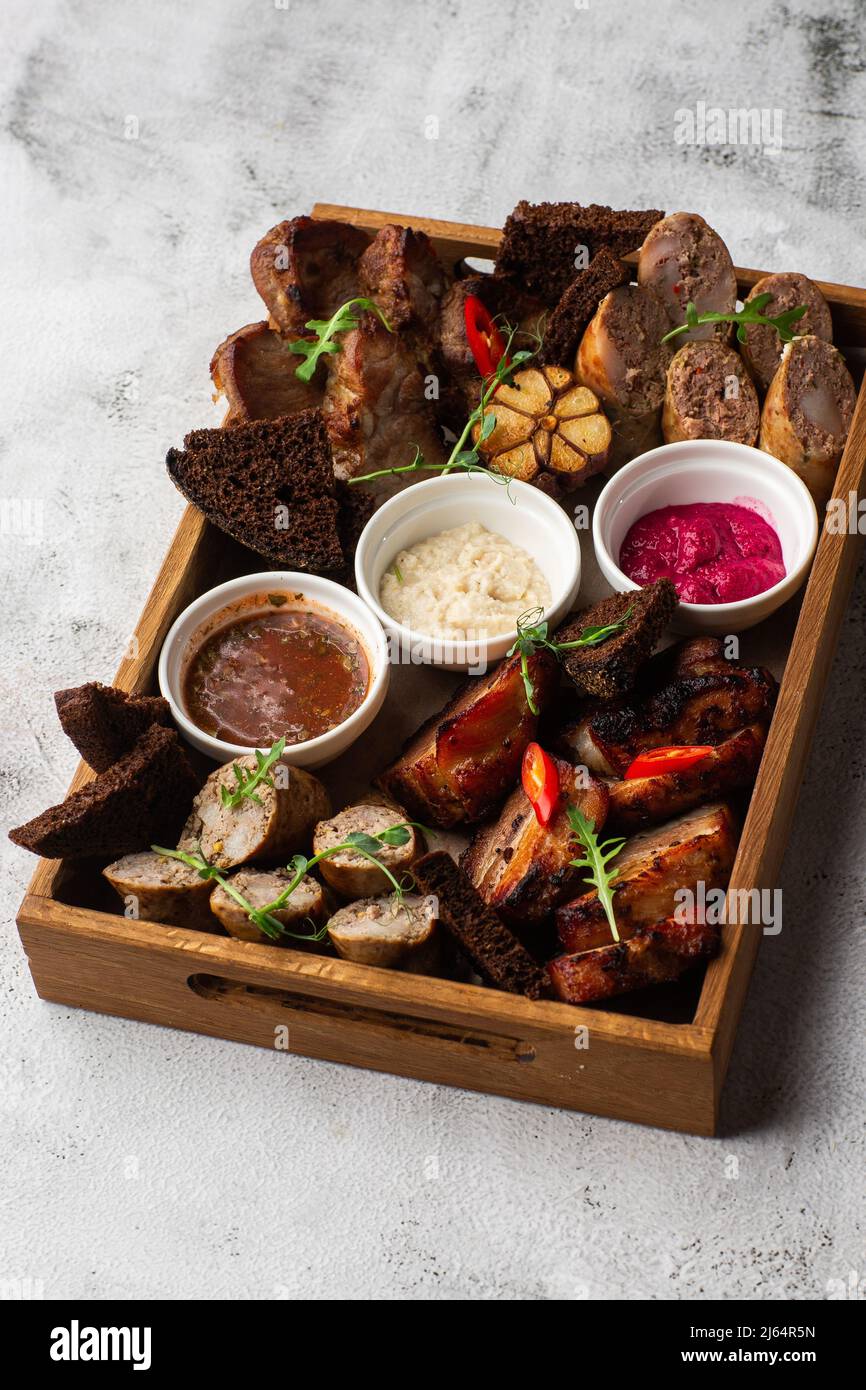 Close-up photo of mixed grilled meat platter. Beef, pork, poultry ...