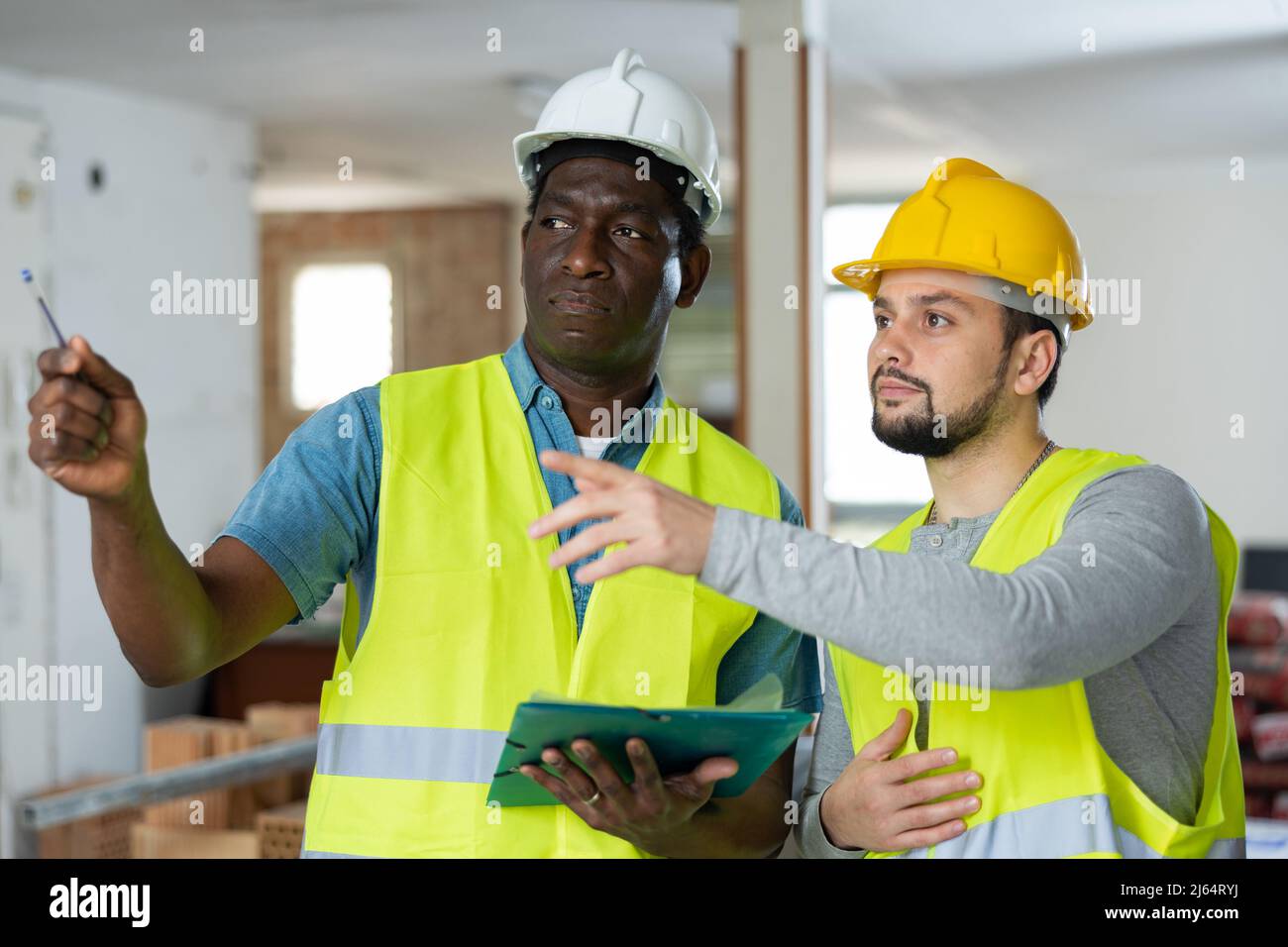 Engineer indicate anything to work on construction site Stock Photo - Alamy