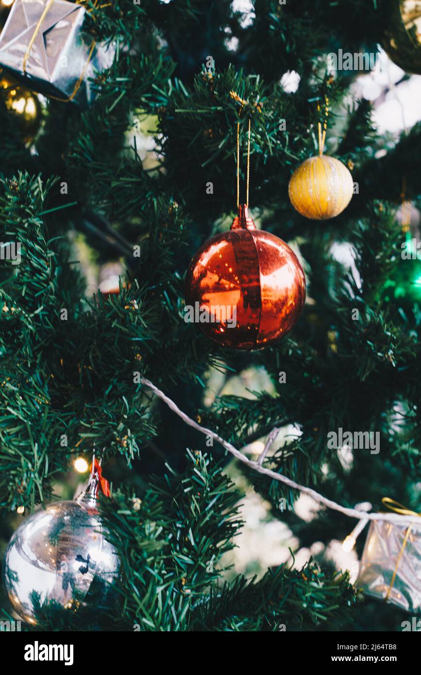 Christmas tree ball decorate on pine tree branch vintage toned happy ...