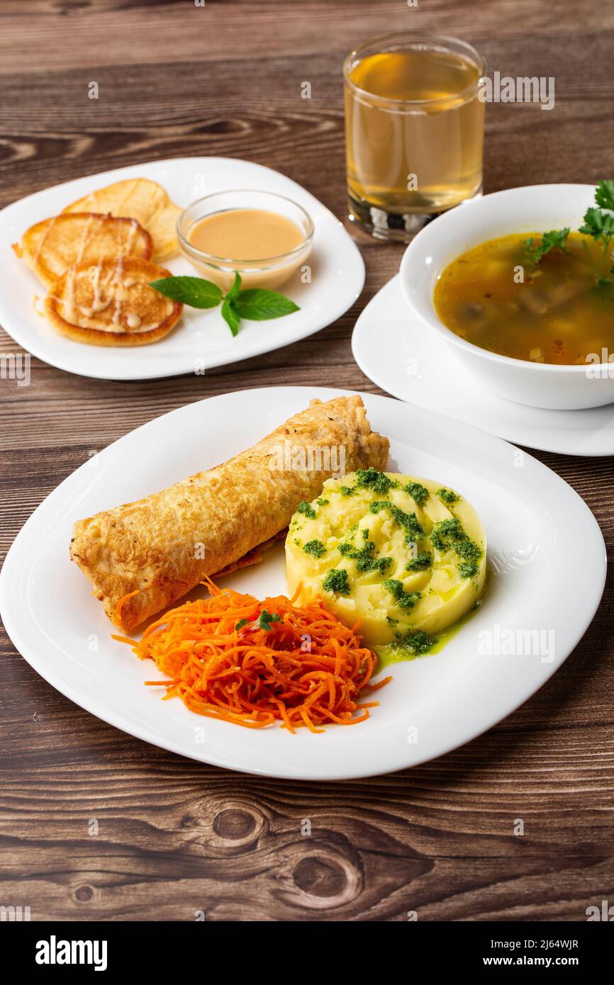 Ukrainian business lunch menu. Crispy pork chop served with warm potato ...