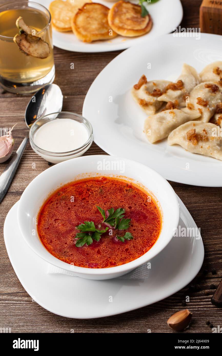 Traditional ukrainian dish vareniki and borscht served with greaves and ...