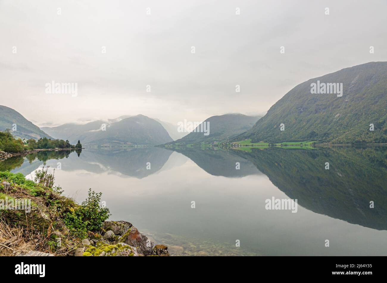 Reflection in Norway fjord at fall time Stock Photo - Alamy