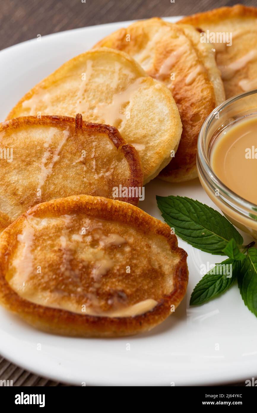 Pile of freshly fried thick pancakes, in Eastern European cuisines ...