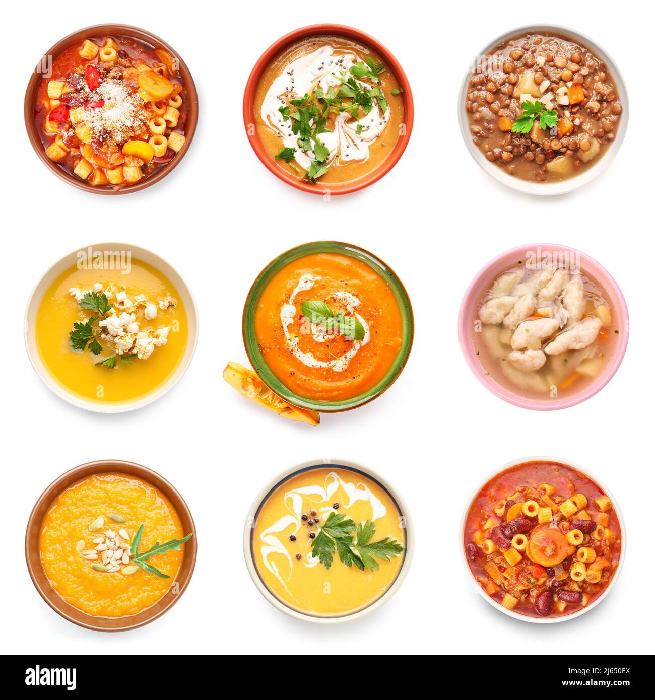 Set of tasty soups in bowls on white background, top view Stock Photo ...