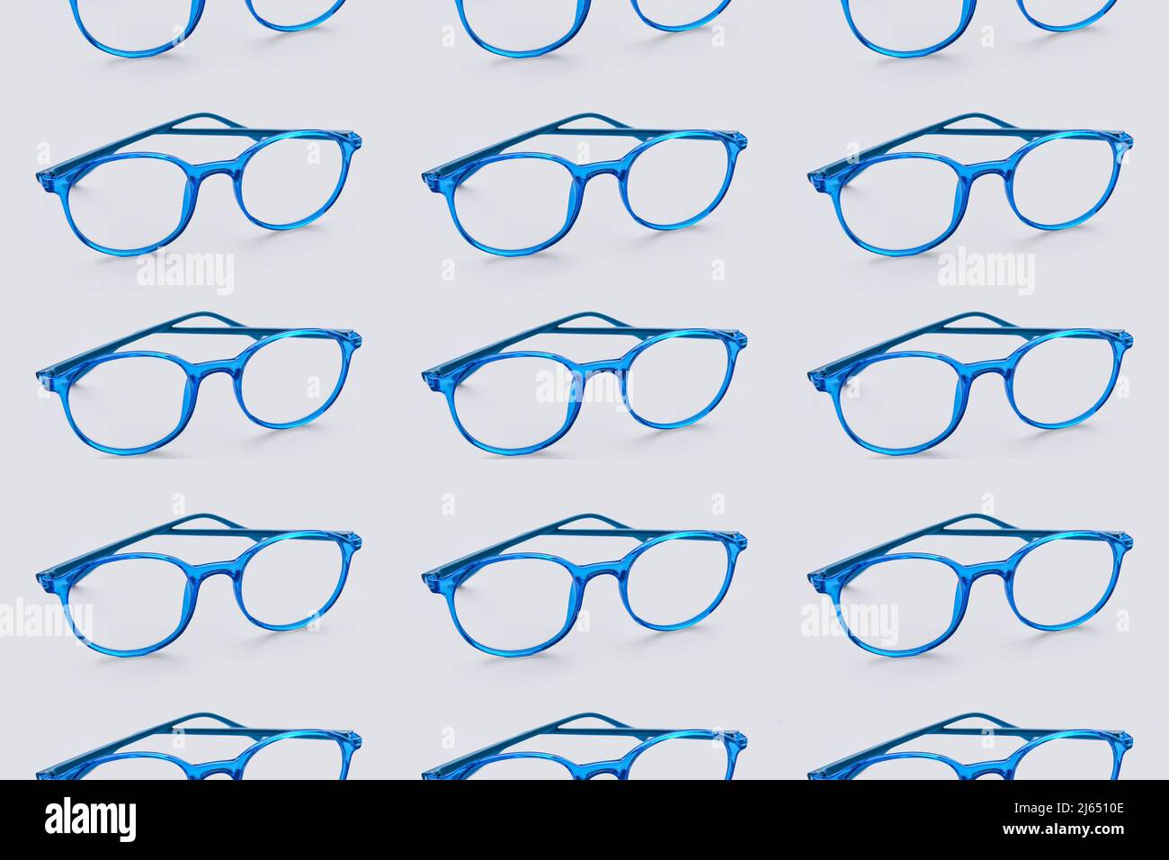 Stylish eyeglasses on light blue background. Pattern for design Stock ...
