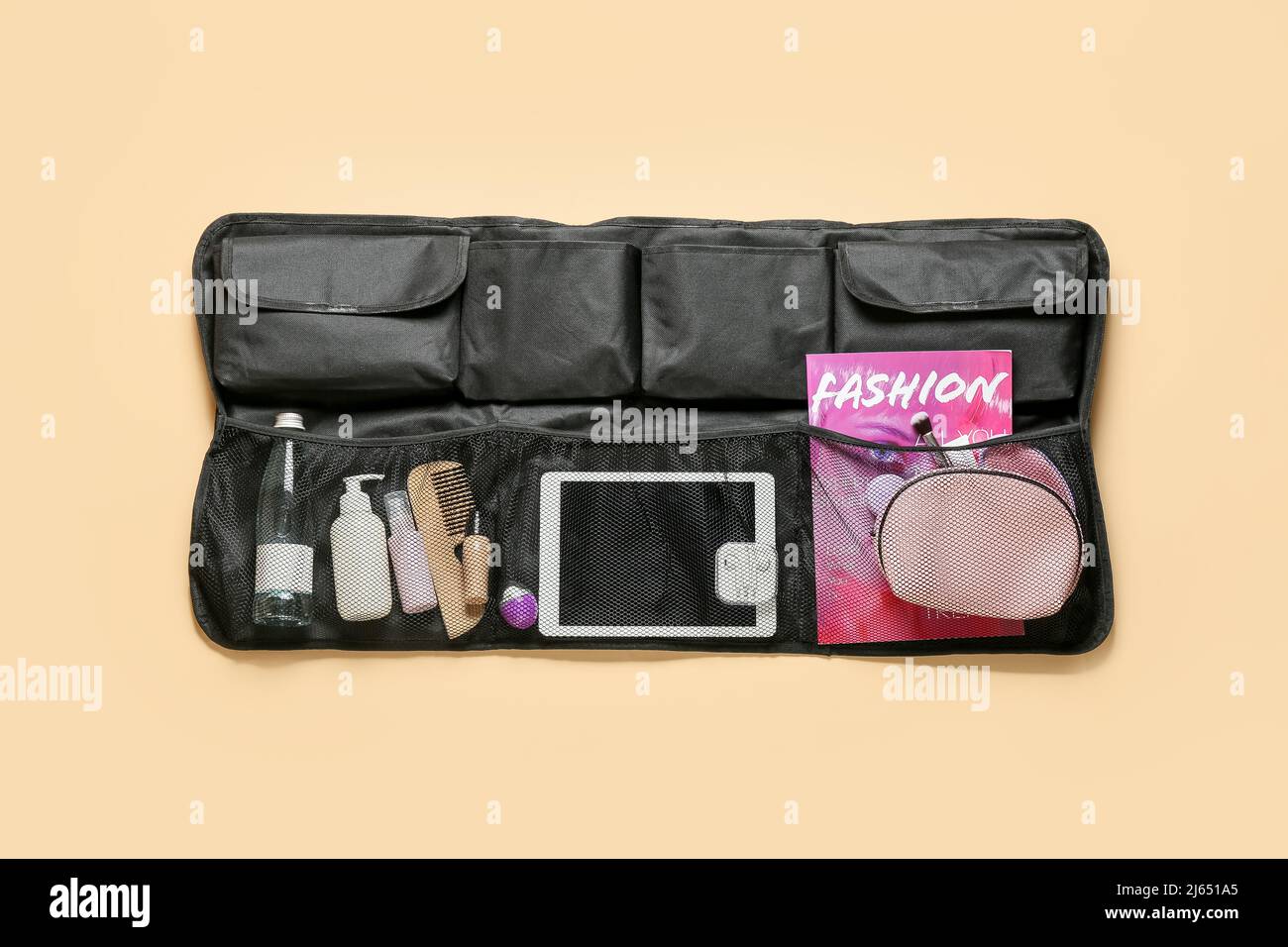 Black travel organizer with different things on color background Stock ...