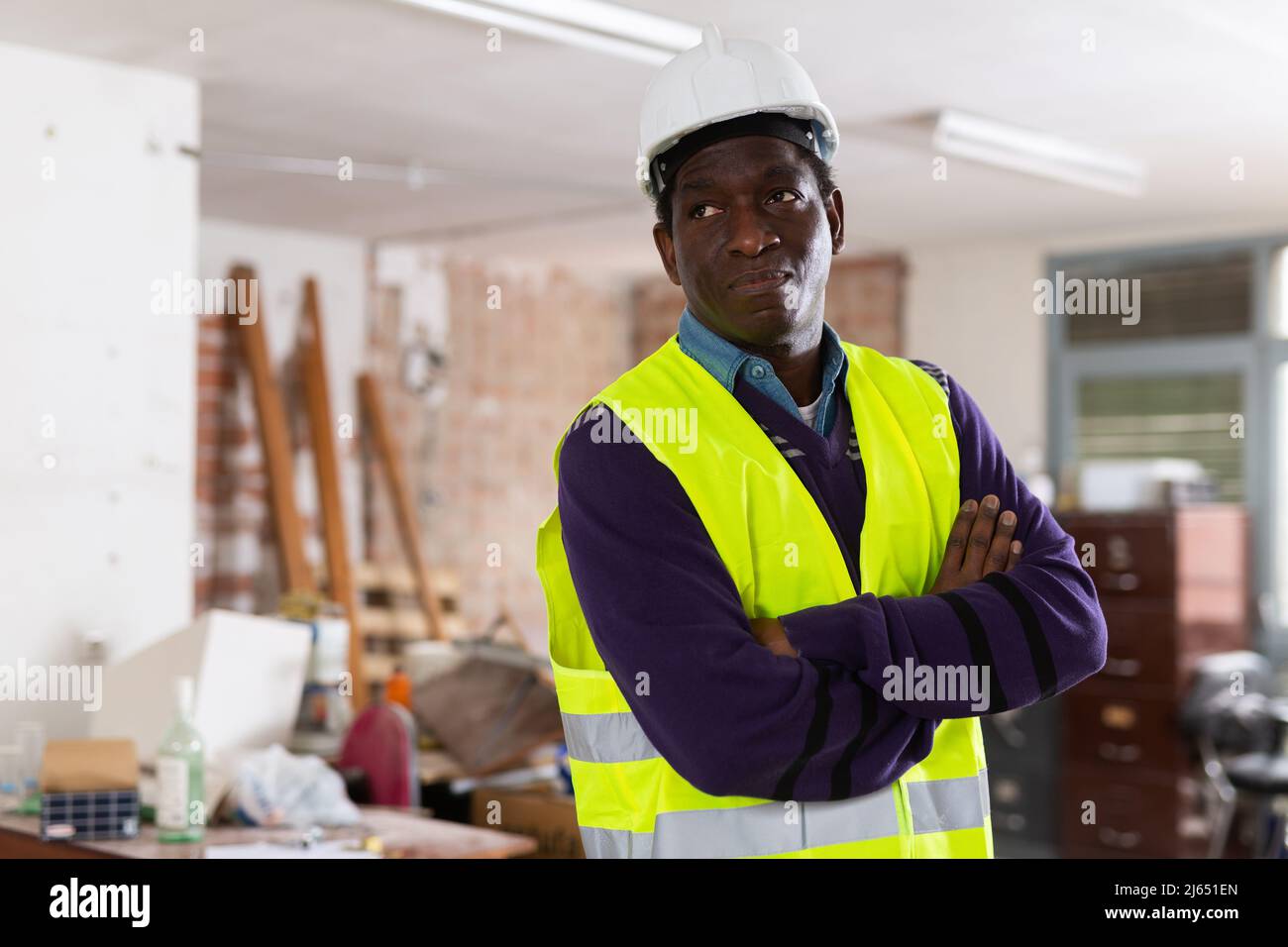Confident african american engineer standing n building under ...