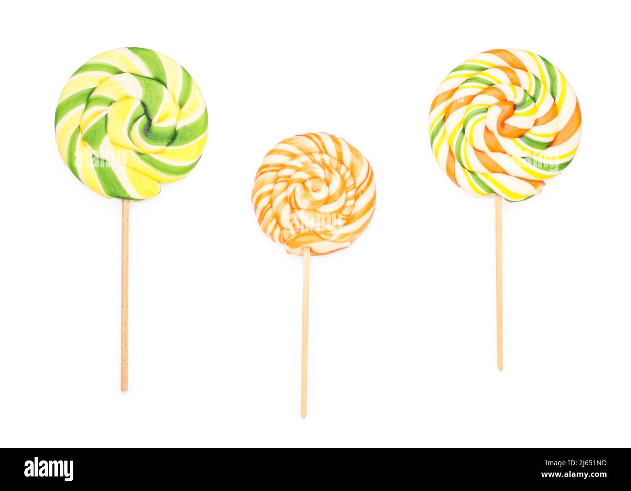Three round lollipops on white background Stock Photo - Alamy