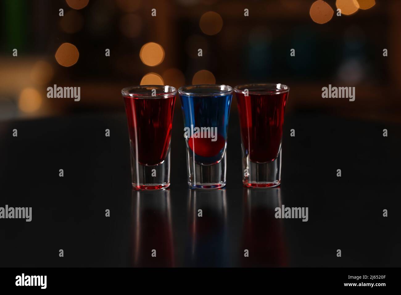 Shot cocktails on table in bar Stock Photo - Alamy