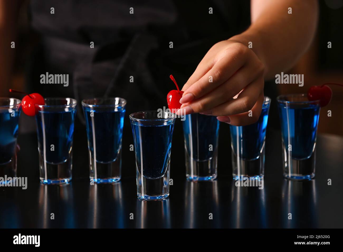 Female bartender making tasty shot cocktails in bar, closeup Stock ...