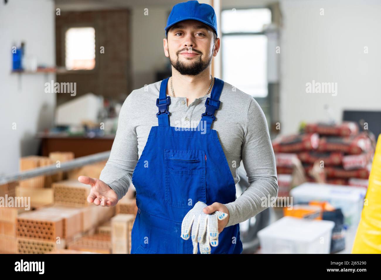 Contractor showing work done in building under construction Stock Photo ...