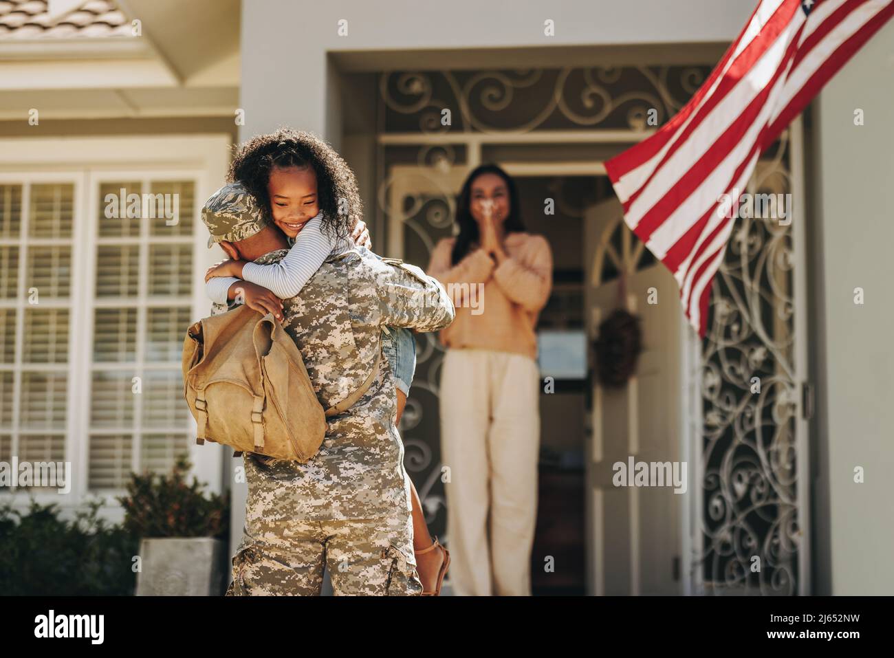 Army soldier embracing his daughter after coming back home. American ...