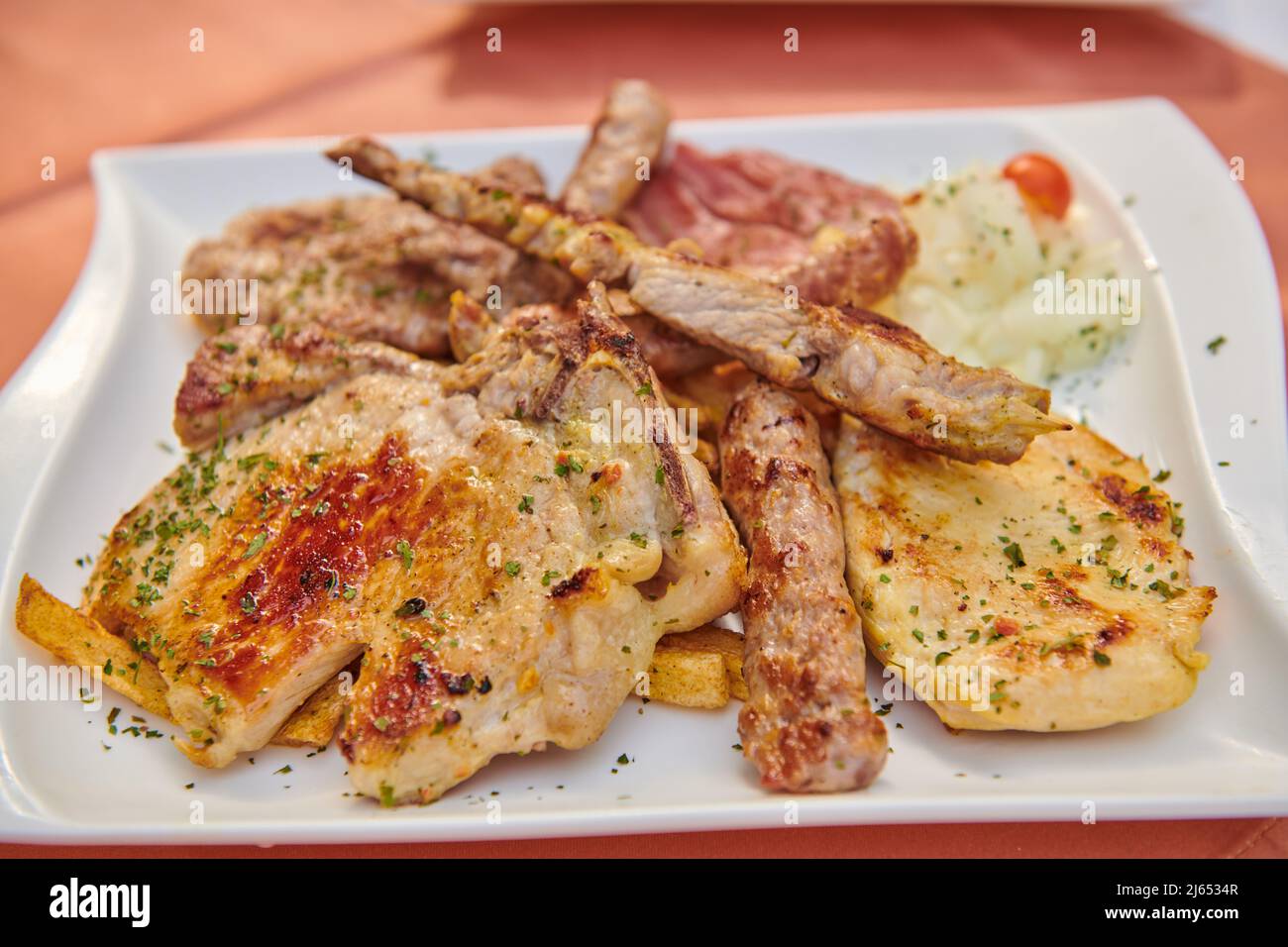assorted different types of meat on a plate Stock Photo - Alamy