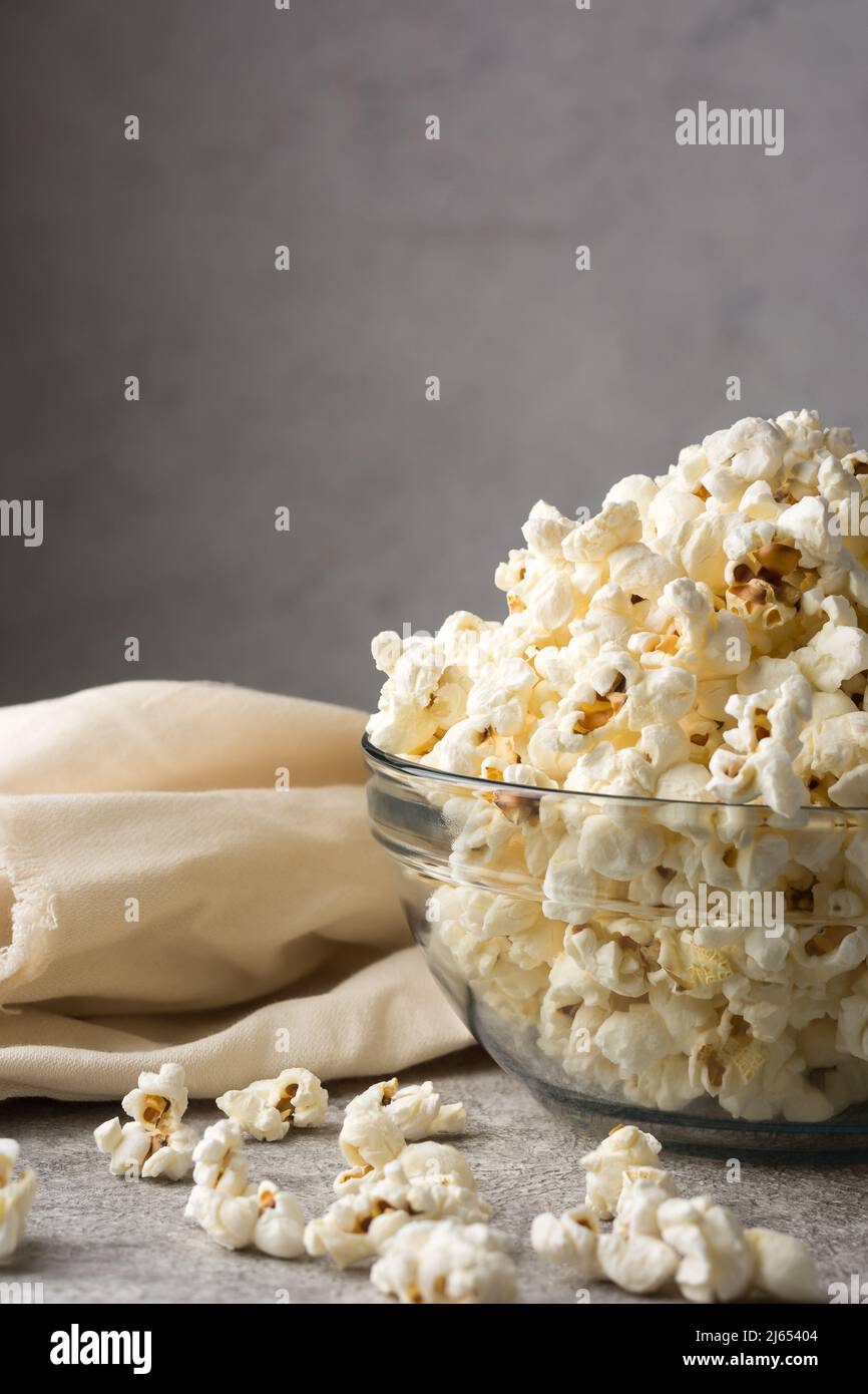 popcorn in a glass cup, delicious, low-fat, healthy snack in a ...