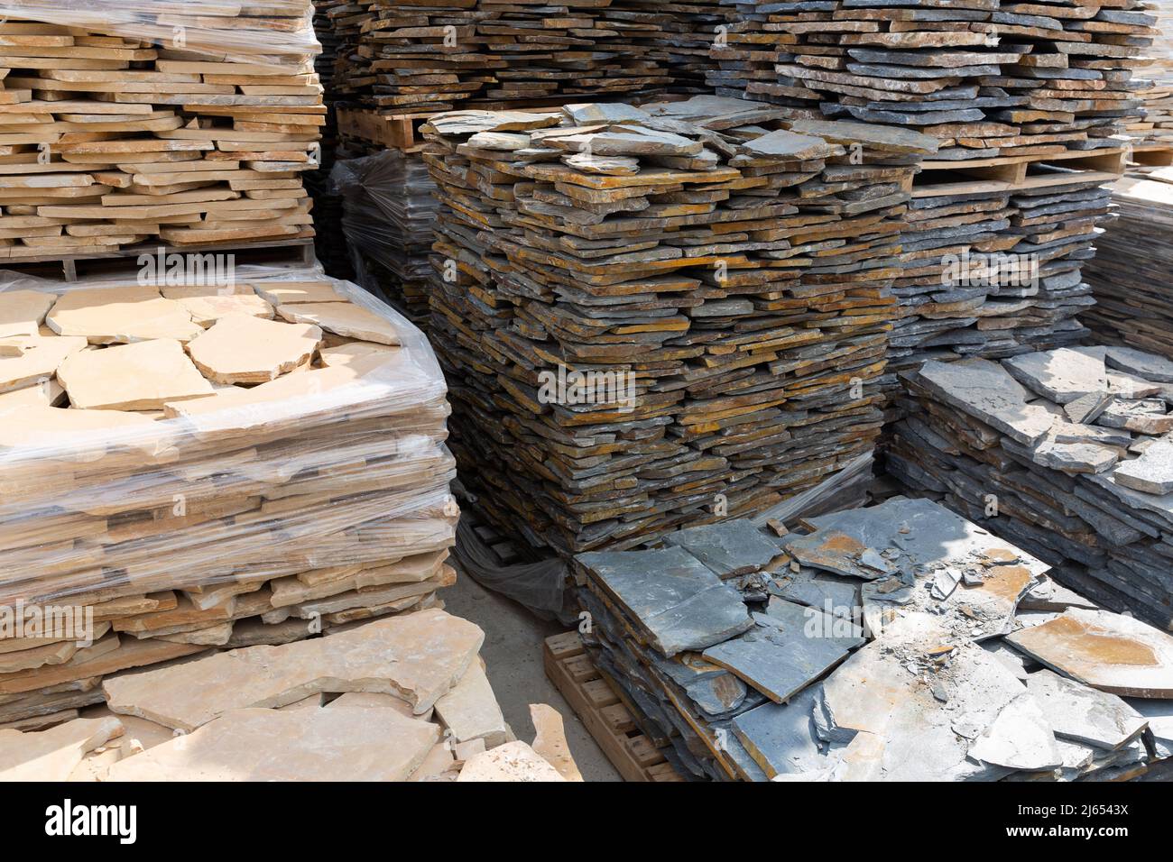 Pallets with natural stone tiles in a warehouse of brick factory Stock ...