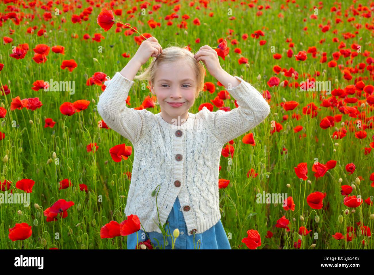 Portrait of beautiful child girl are wearing casual clothes in field of ...