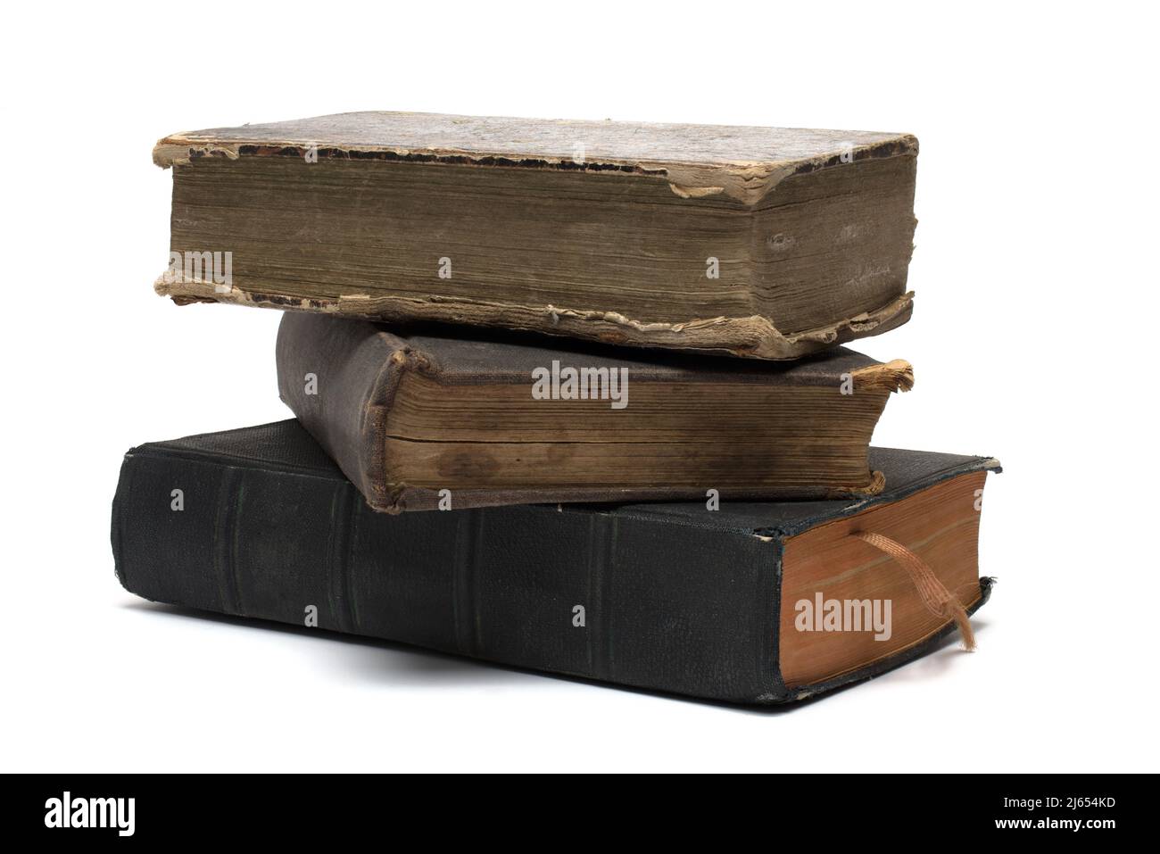 Close up three stacked worn retro very old with leather binding ...