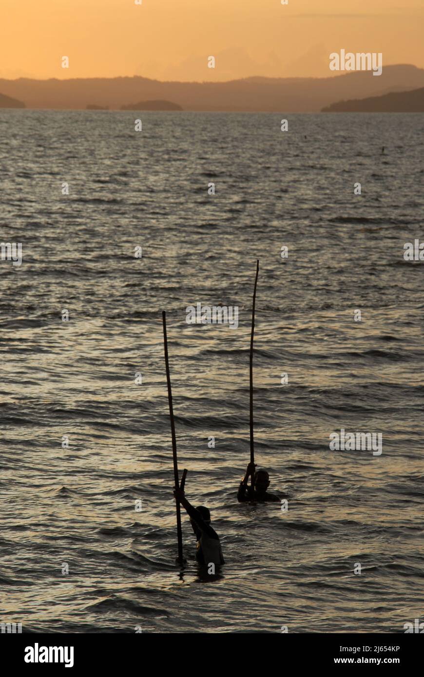 Men with spears fishing shells and scallops on the sea, Valladolid ...