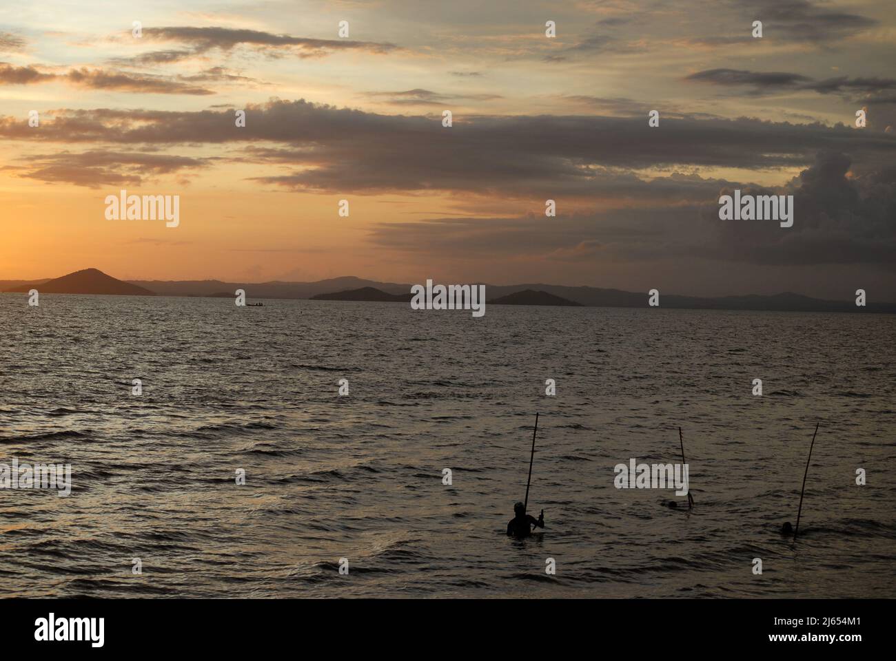 Men with spears fishing shells and scallops on the sea, Valladolid ...
