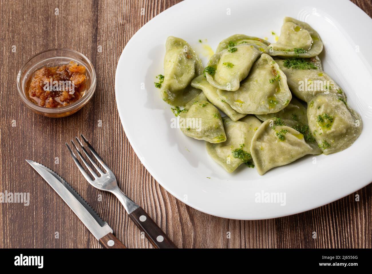 Traditional ukrainian dish vareniki served in a bowl with greaves and ...