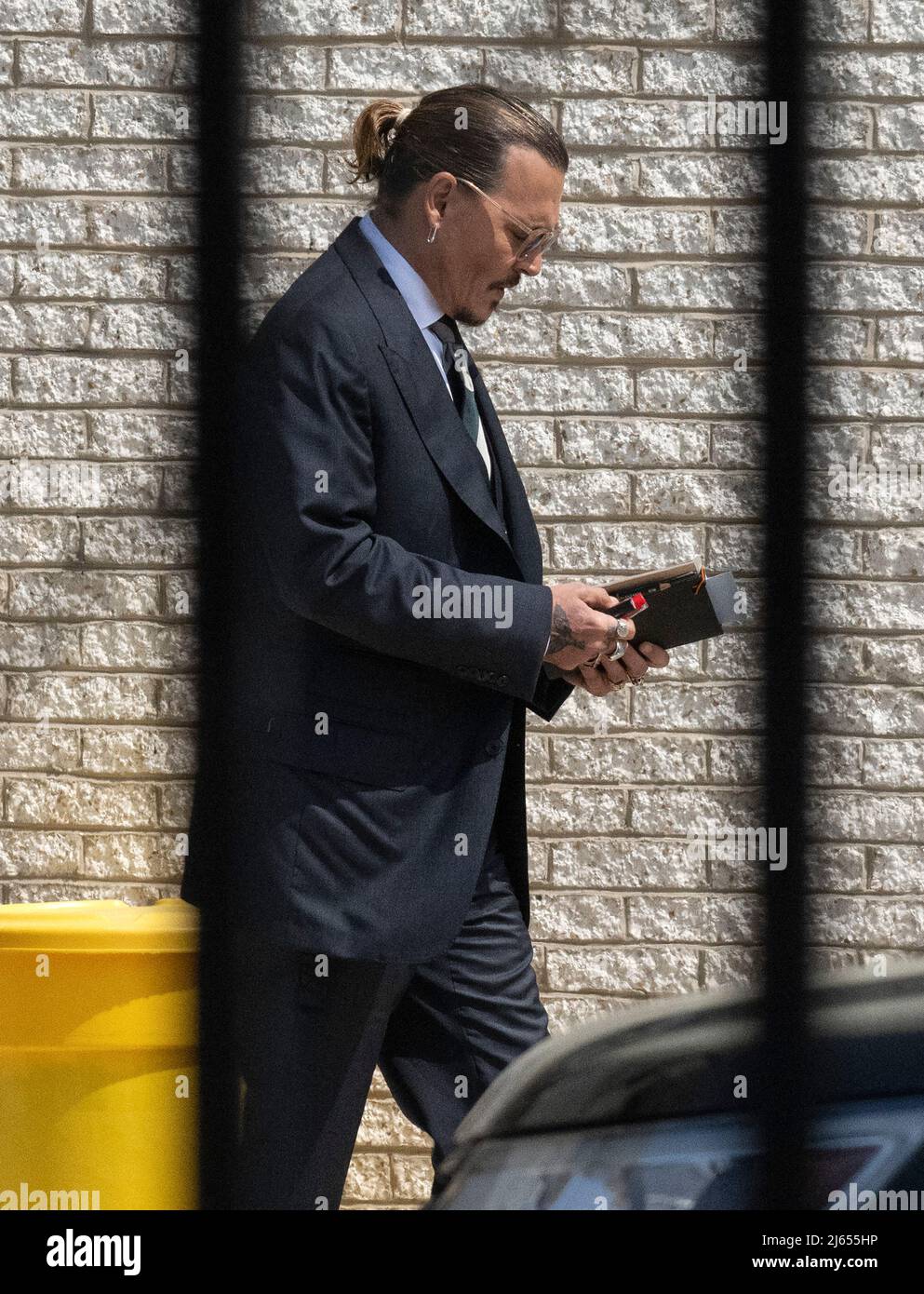 Johnny Depp goes outside during a short recess during day 10 of his ...