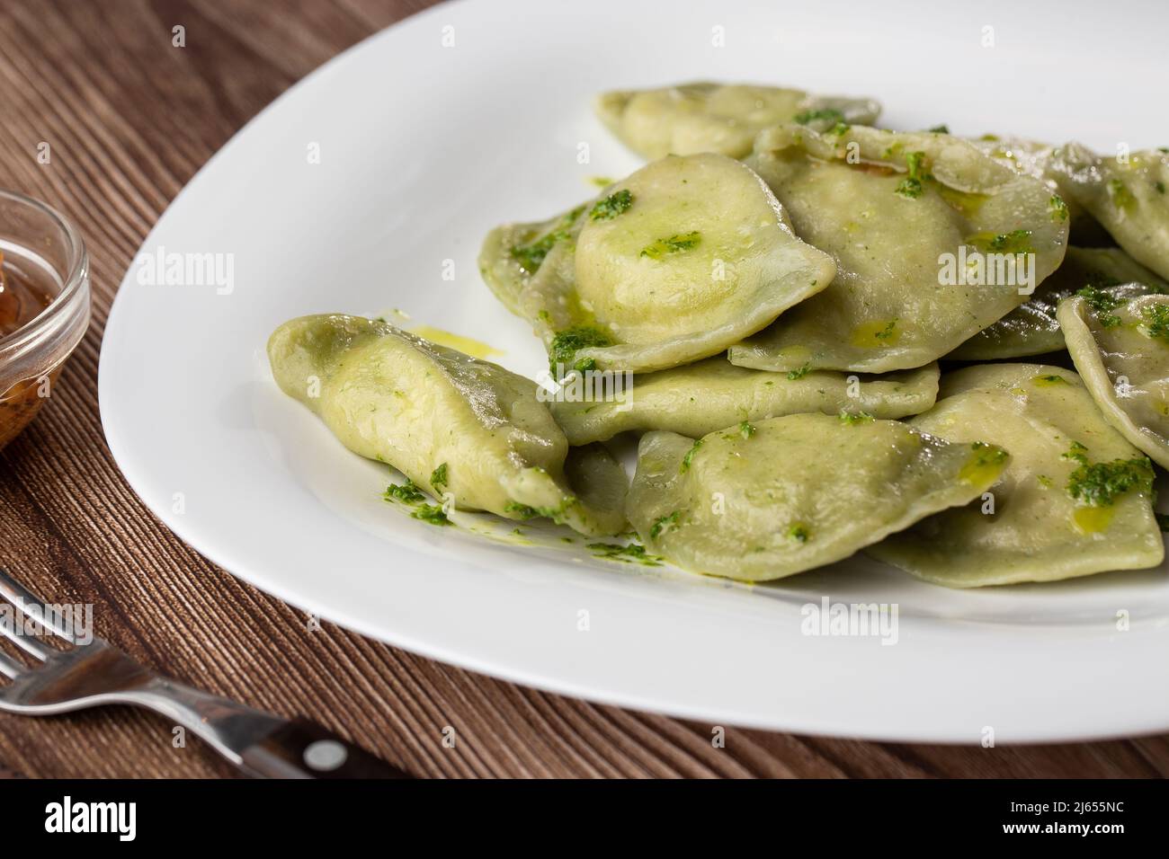 Traditional ukrainian dish vareniki served in a bowl with greaves and ...