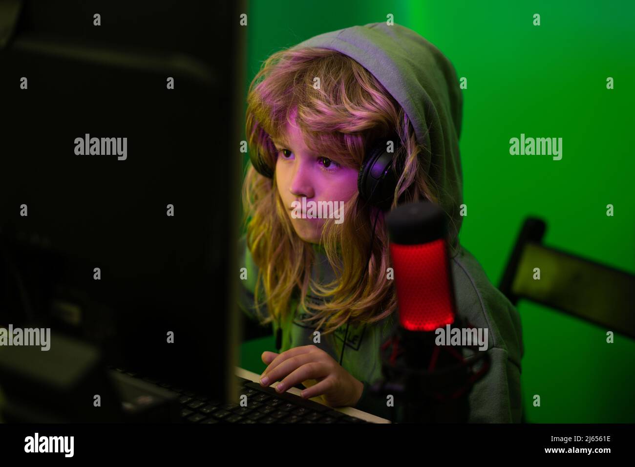 Child boy play in computer game. Child with computer late at night ...