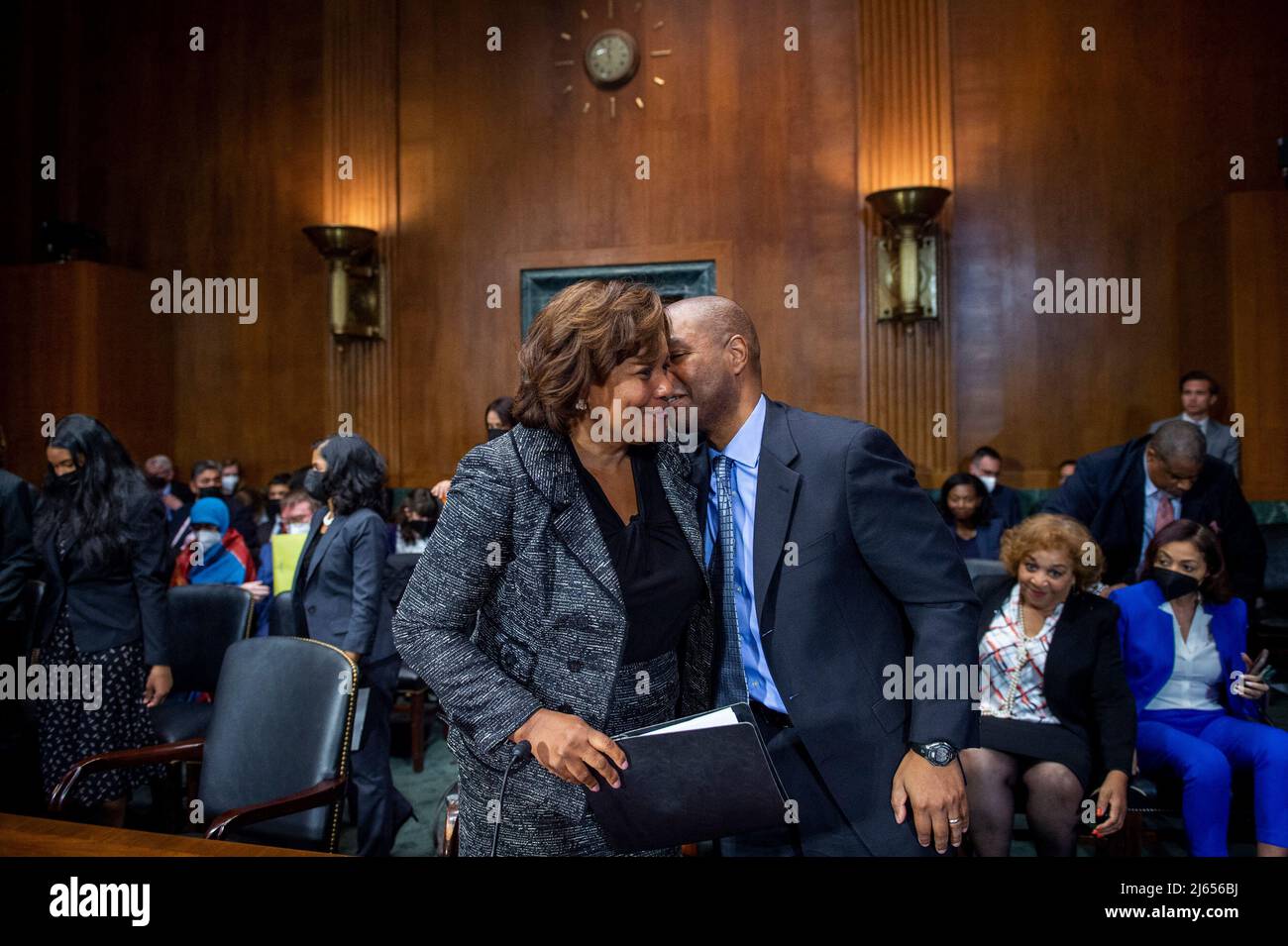 Julianna Michelle Childs, left, gets a kiss from her husband Dr. Floyd ...