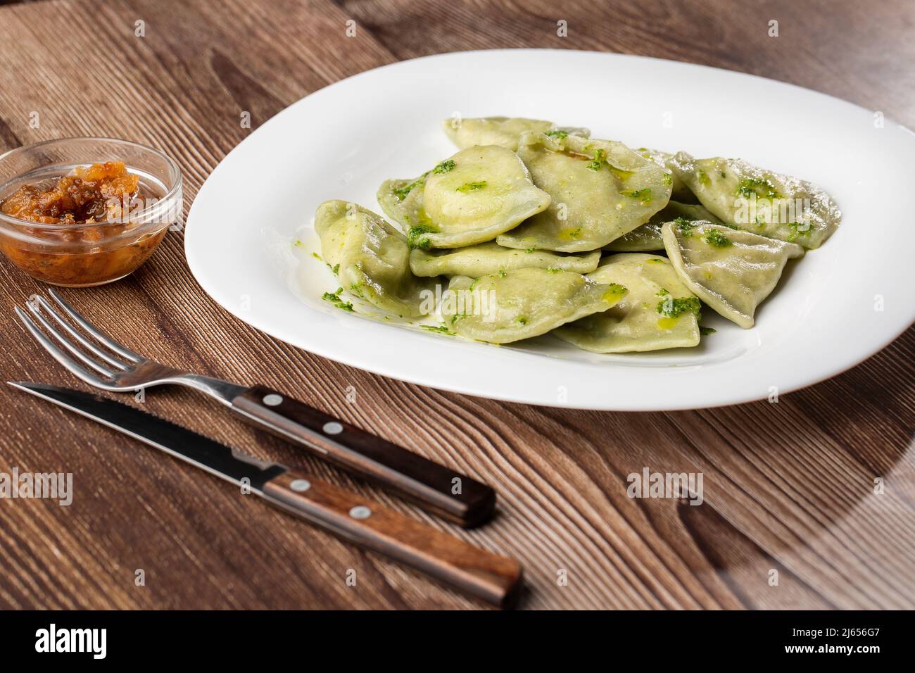 Traditional ukrainian dish vareniki served in a bowl with greaves and ...
