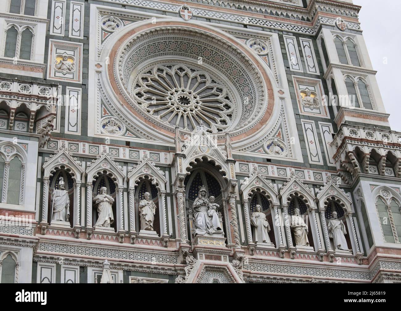 circular window and statues of Saints in the Cathedral of Florence in ...
