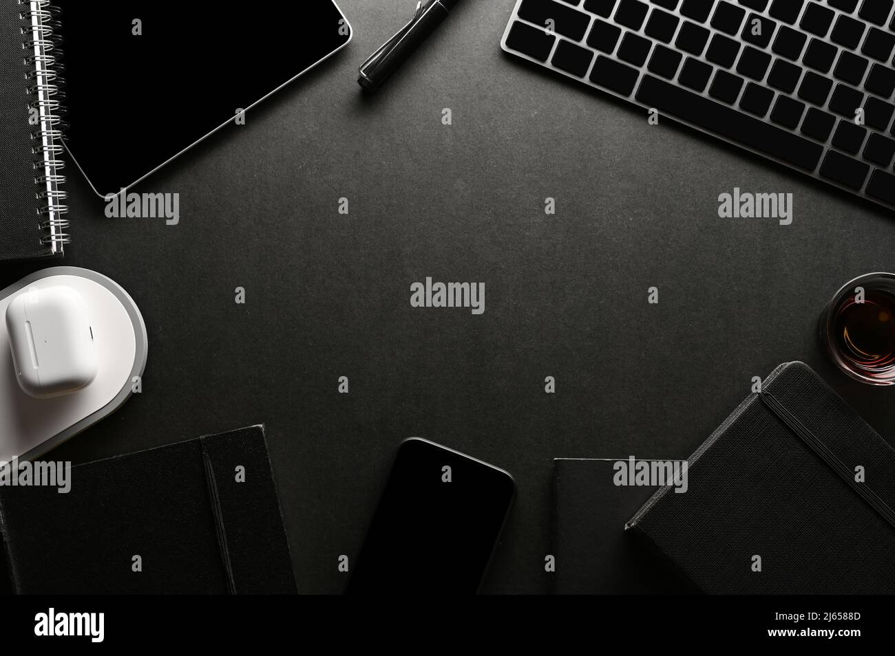 Top, Black workspace background with copy space and surrounded by ...