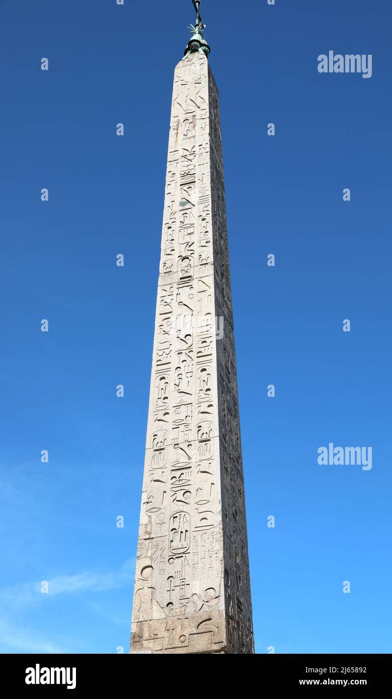 Ancient egyptian obelisk with hieroglyphs and the blue sky in background Stock Photo - Alamy