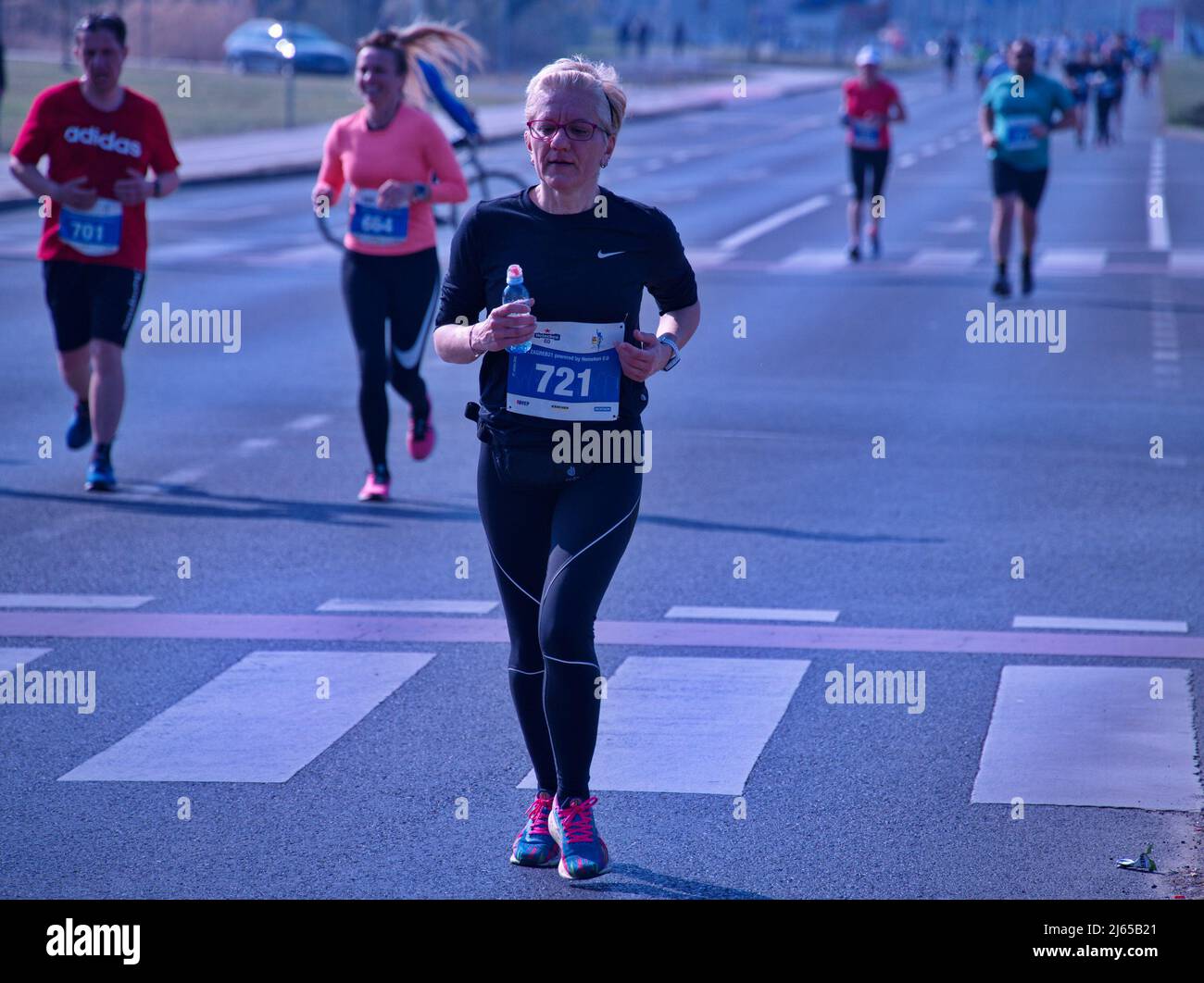 Active senior woman running marathon Stock Photo - Alamy