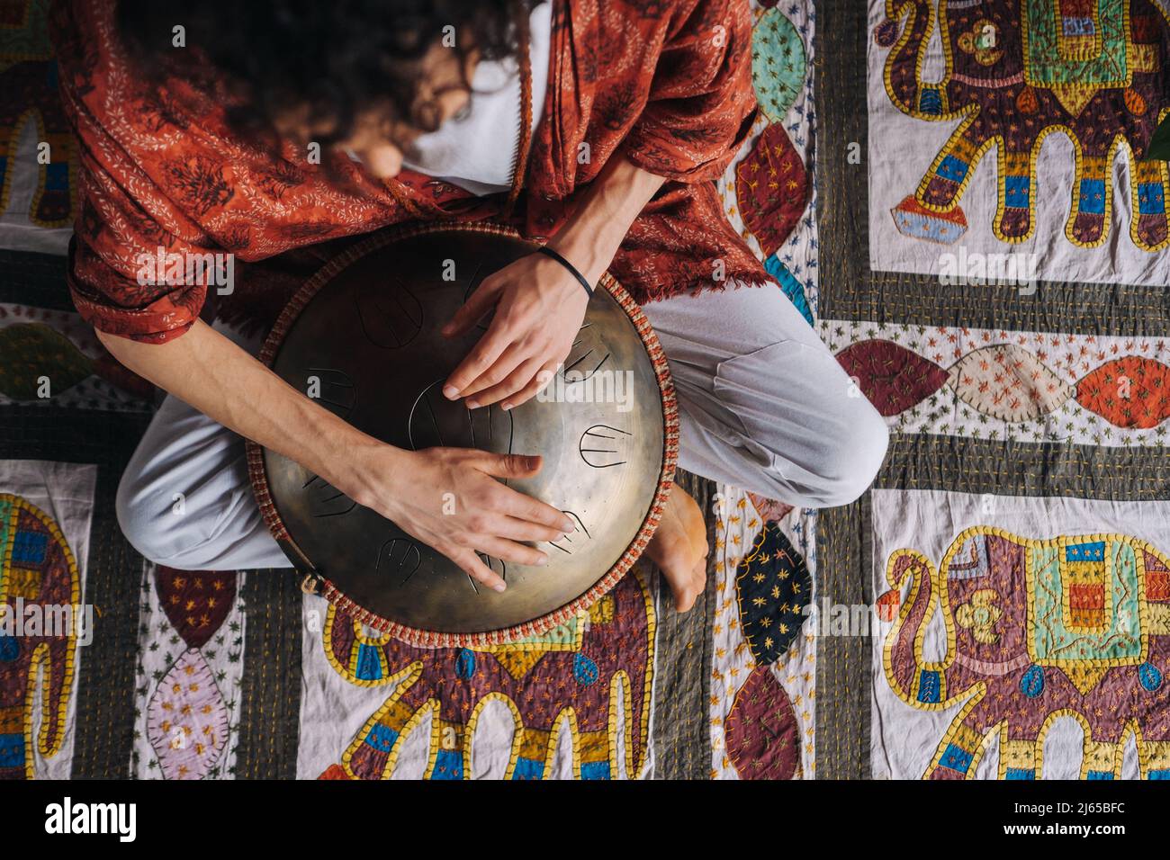 Close-up of a man's hand playing a modern musical instrument, the orion ...