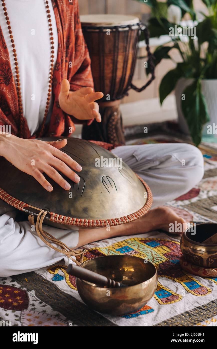 Close-up of a man's hand playing a modern musical instrument, the orion ...
